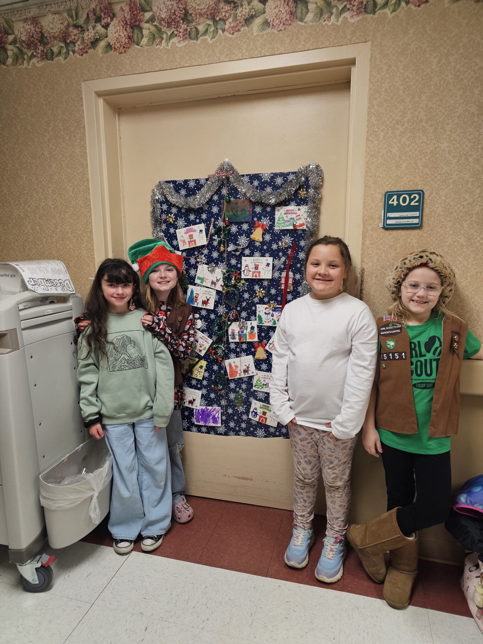Girl Scouts decorate resident doors for the holidays - Morgan Messenger