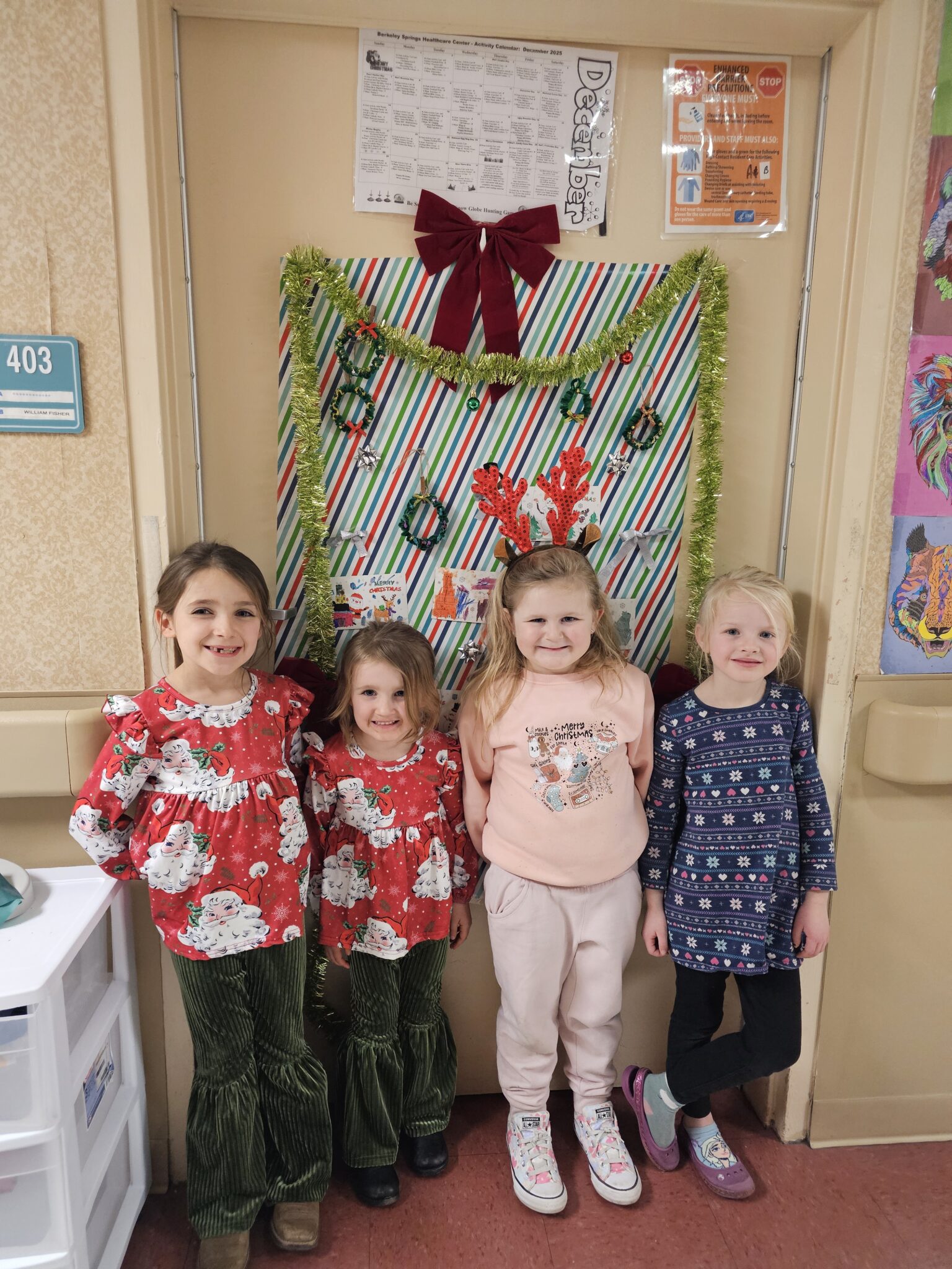 Girl Scouts decorate resident doors for the holidays - Morgan Messenger